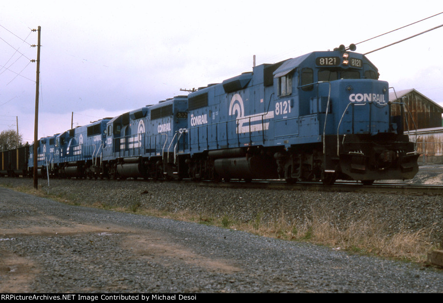 CR GP-38-2 #8121 leads a multi unit lashup westbound